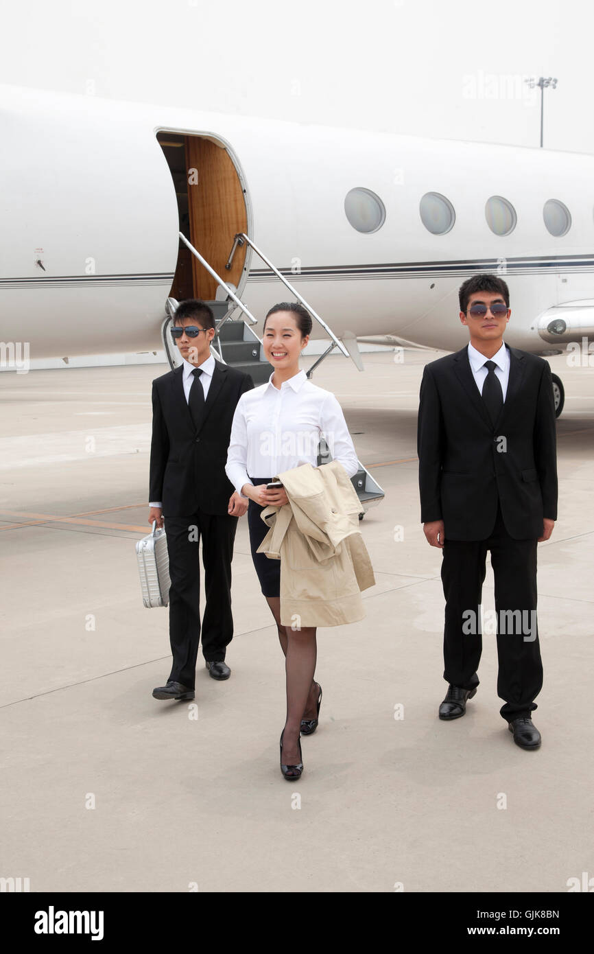 Business people and business aircraft Stock Photo - Alamy