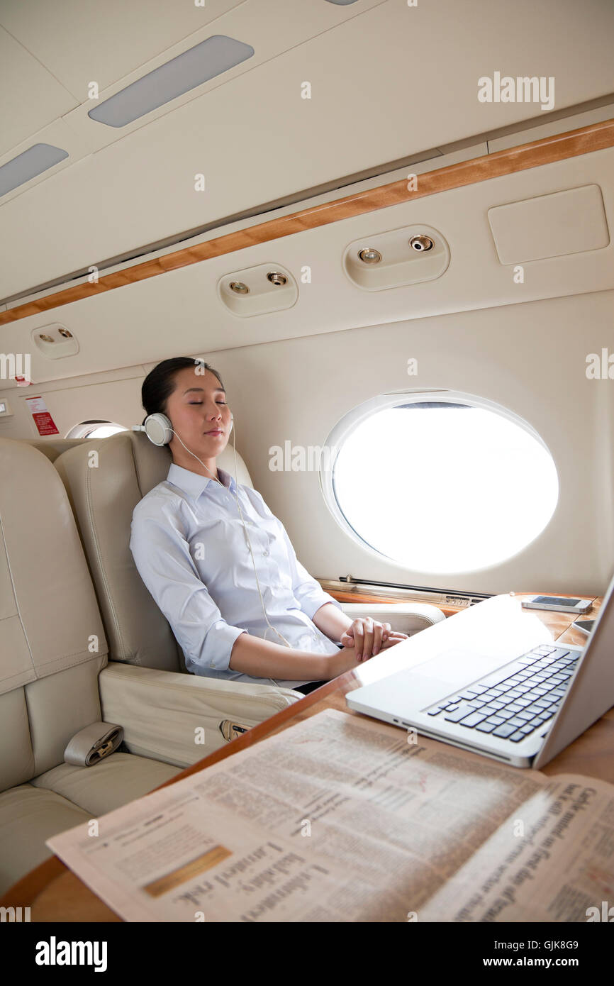 Business lady on the plane Stock Photo - Alamy