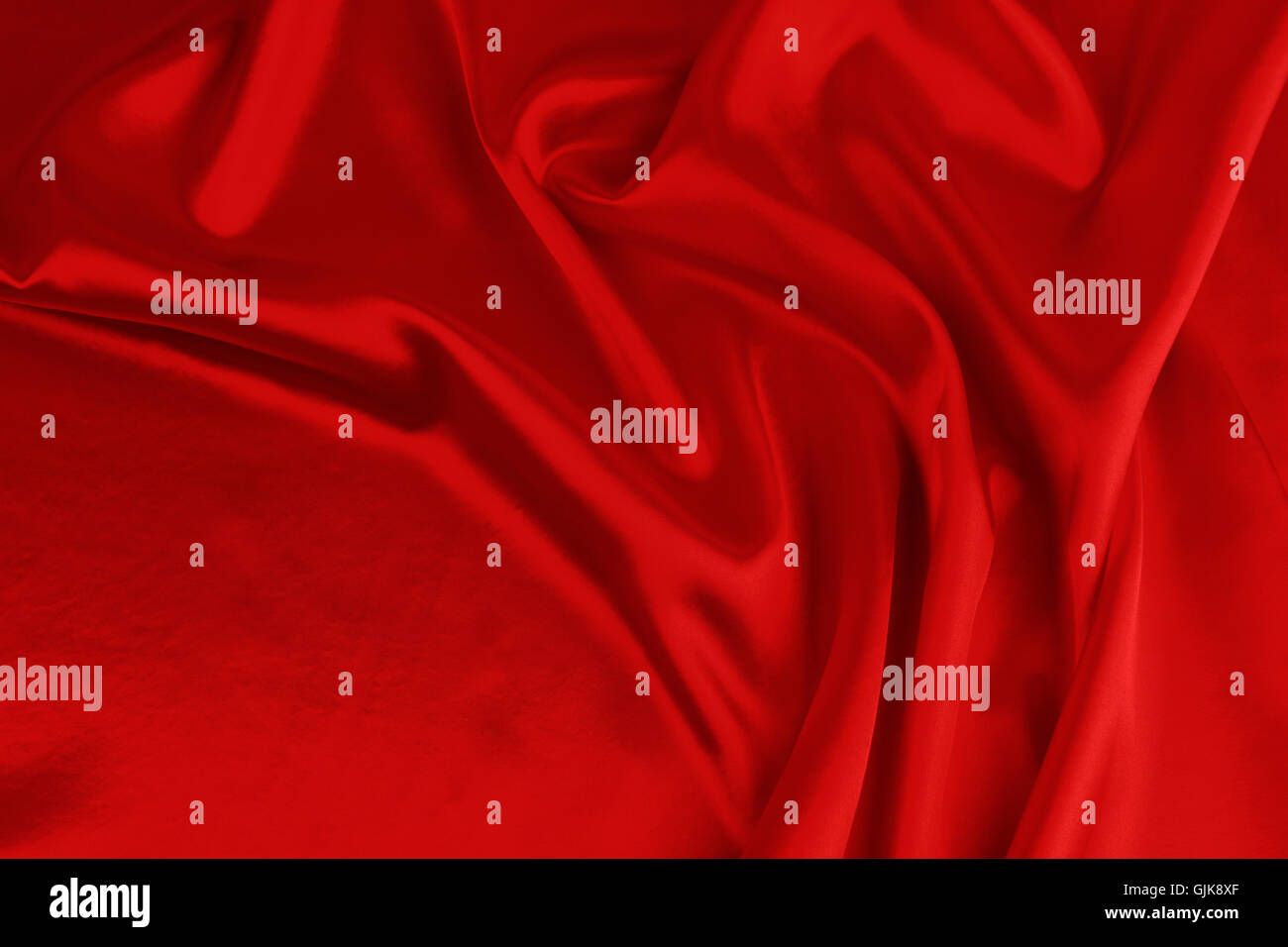 Closeup of ripples in red silk fabric Stock Photo - Alamy