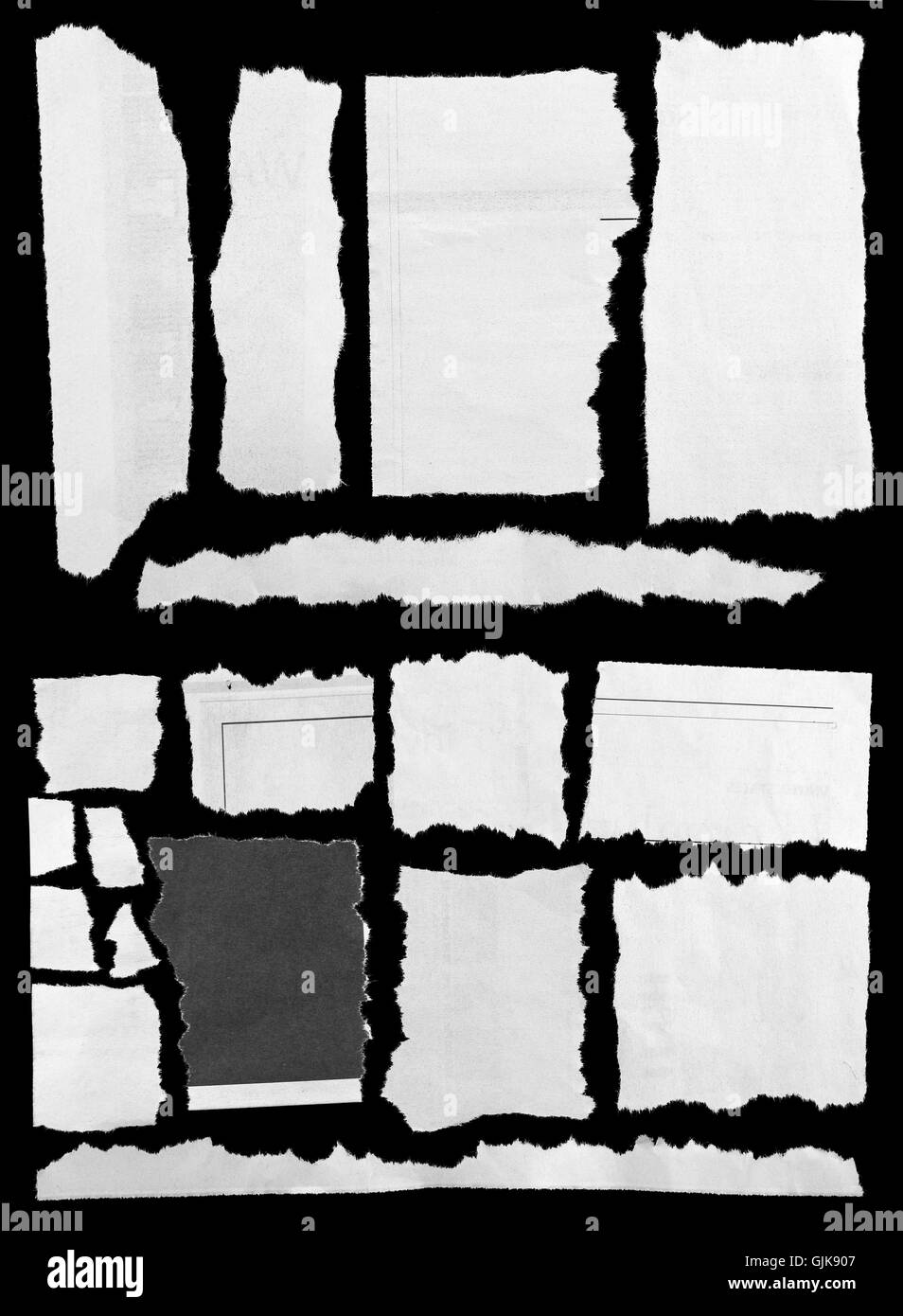 Pieces of torn paper on black Stock Photo - Alamy