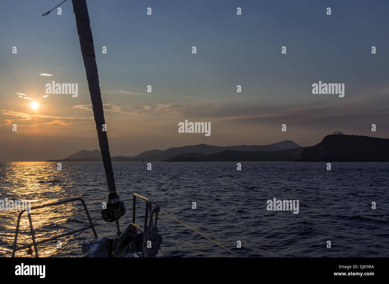 Yacht sailing towards the sunset hi-res stock photography and images ...