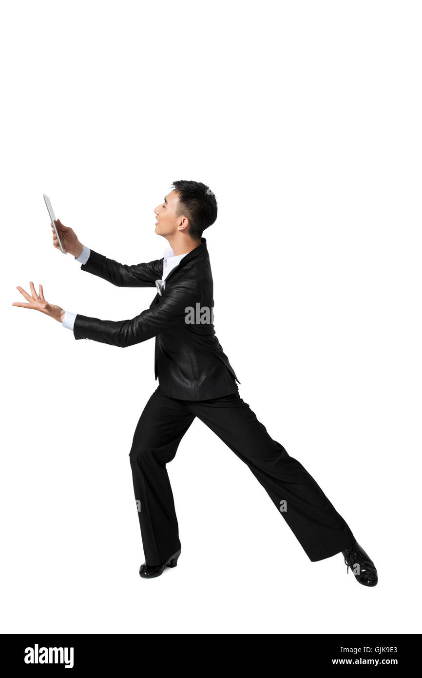 Take your tablet shed clapping dancing young men Stock Photo - Alamy