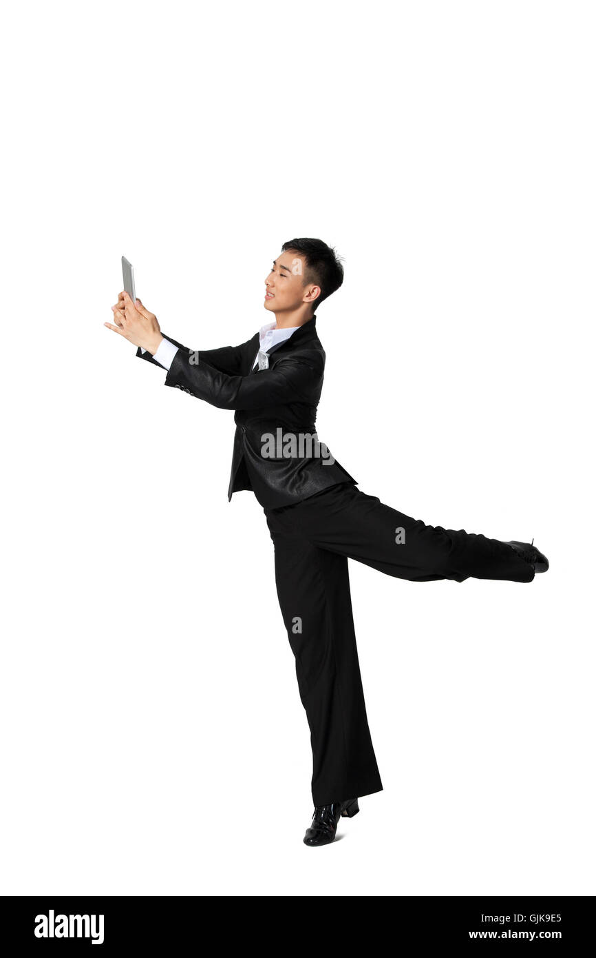 Take your tablet shed clapping dancing young men Stock Photo - Alamy