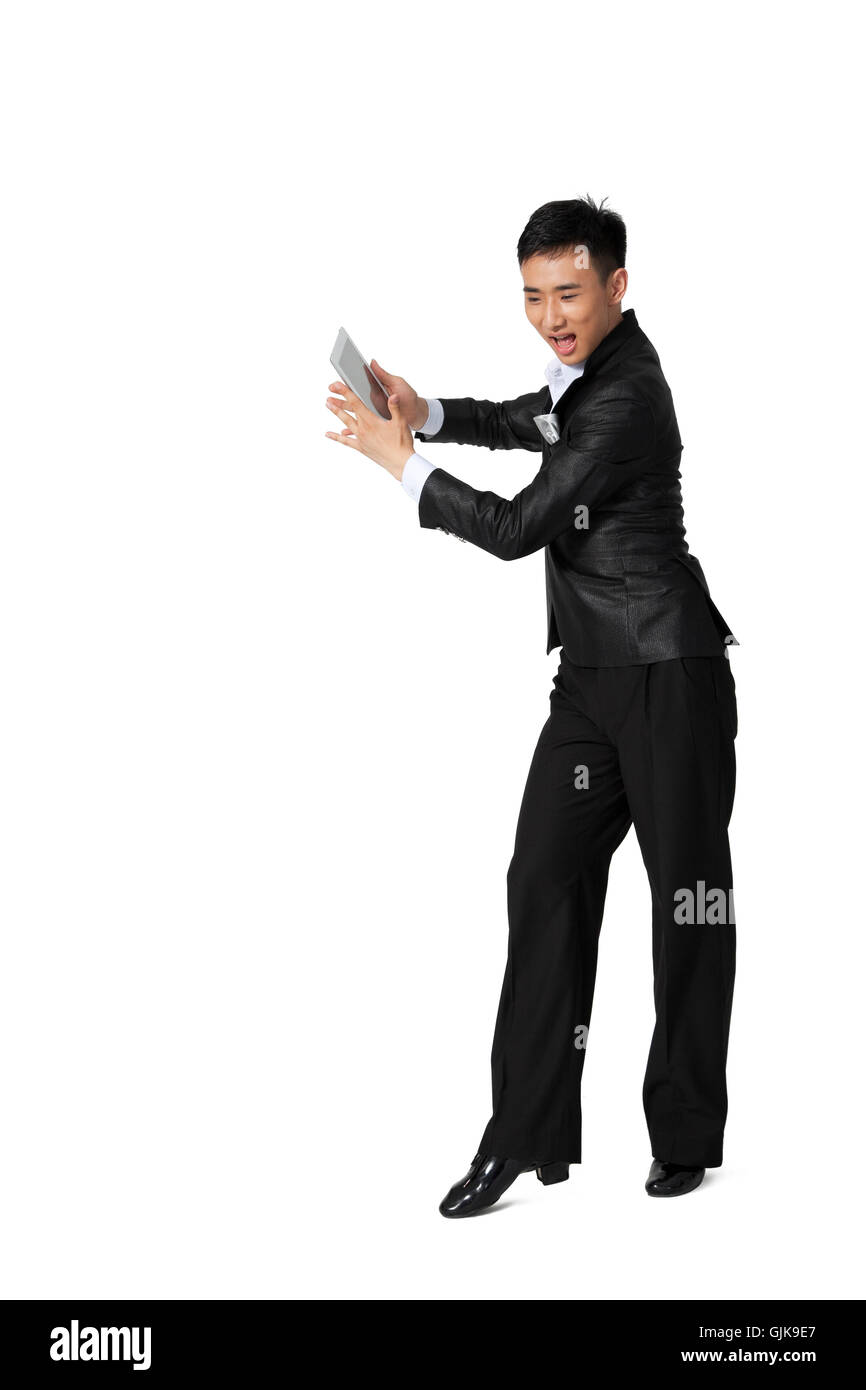 Take your tablet shed clapping dancing young men Stock Photo - Alamy