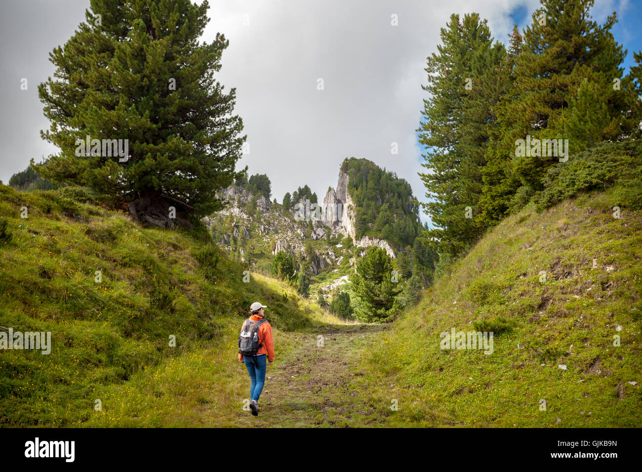 Woman hiking to the top of a mountain hi-res stock photography and ...