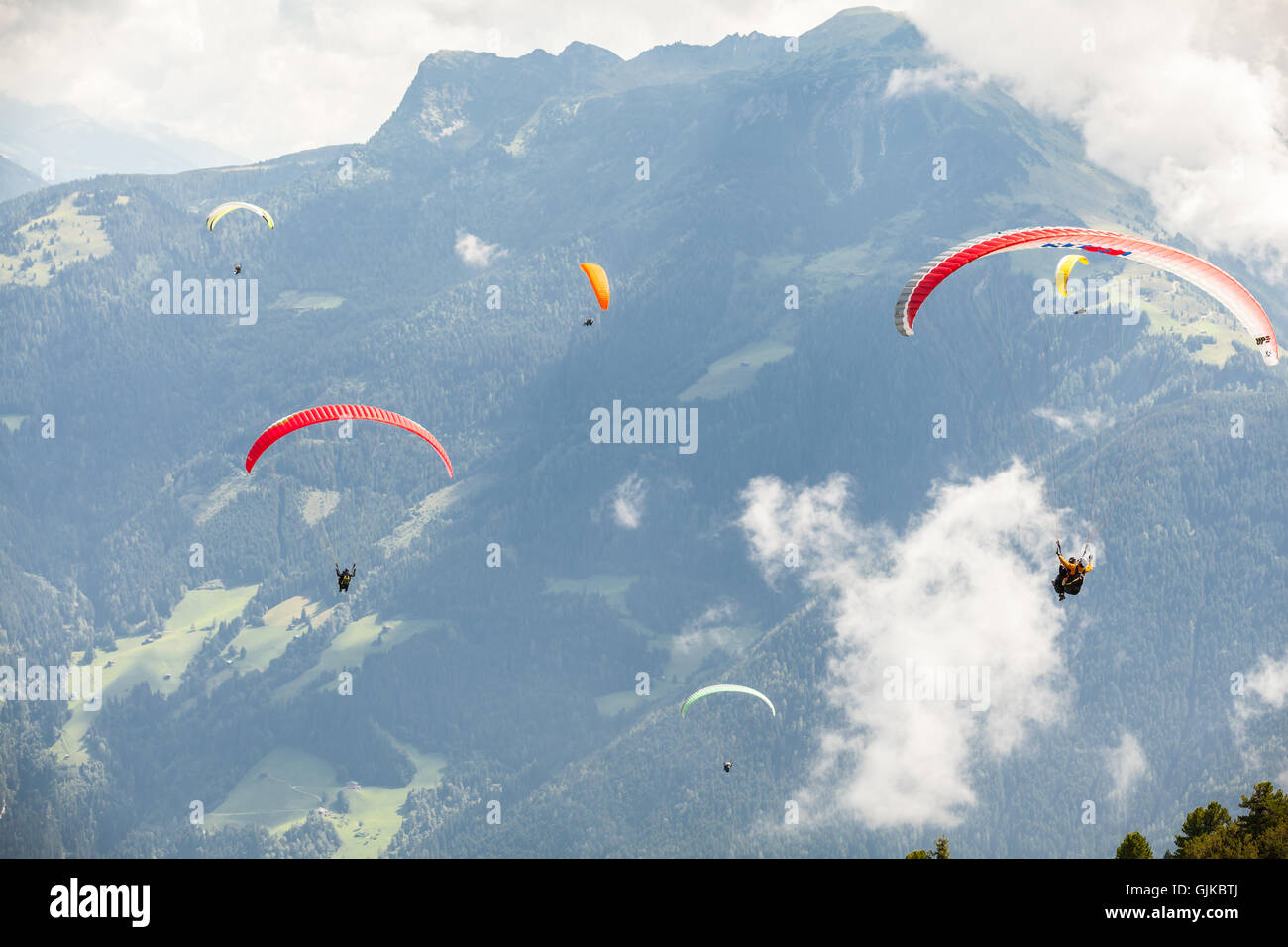 Paragliders flying over the mountains at Penken, Zillertal, Austria ...