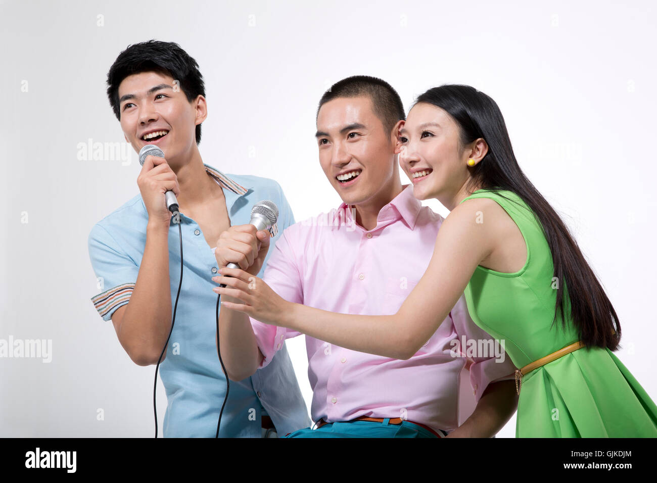 Studio shot casual young man singing Stock Photo - Alamy