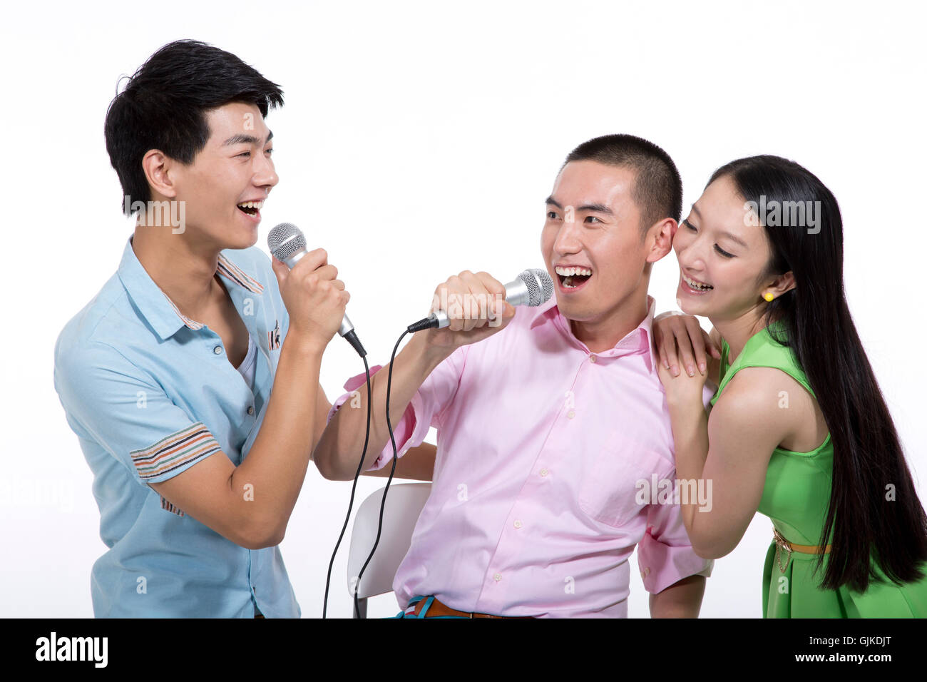 Studio shot casual young man singing Stock Photo - Alamy