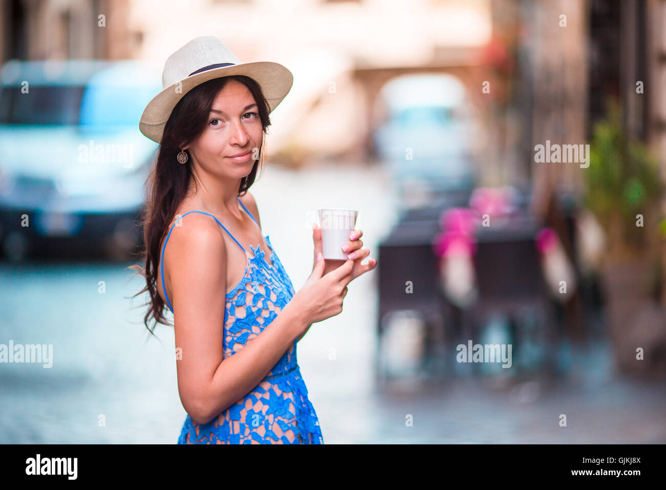 Woman in Rome with coffee to go on vacation travel. Smiling happy ...