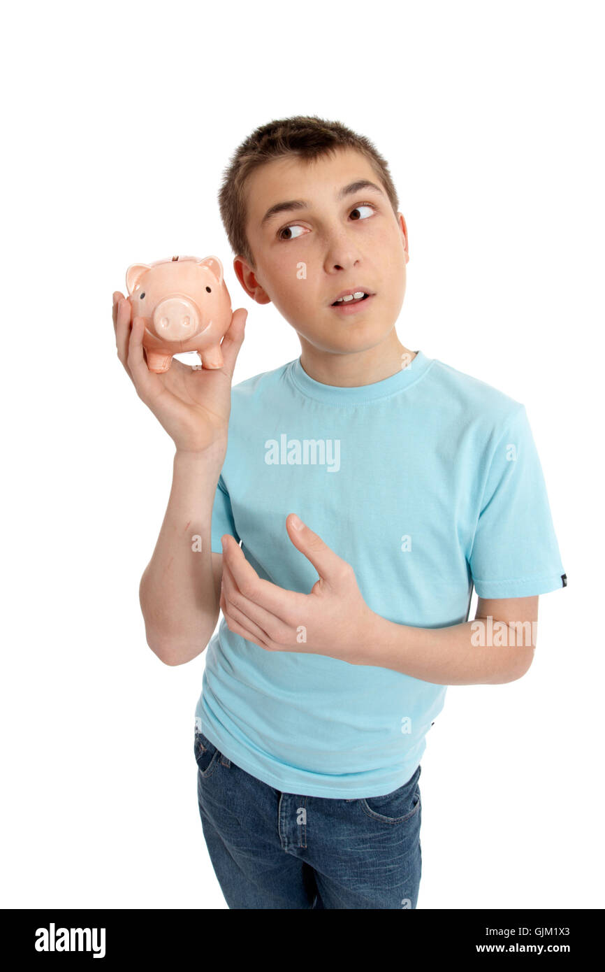 Pre teen boy rattling a money box Stock Photo - Alamy