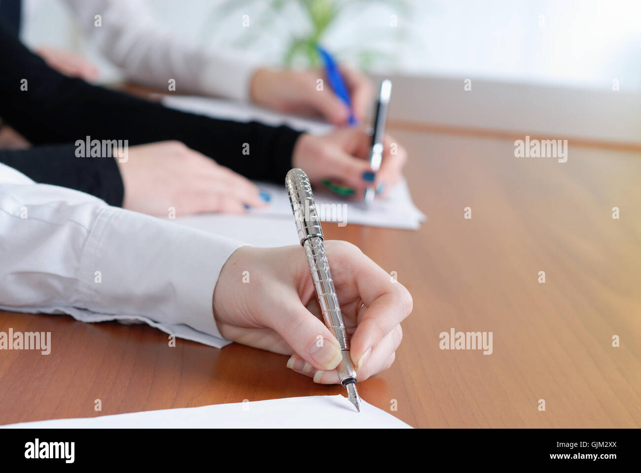 person's hand signing an important document Stock Photo - Alamy