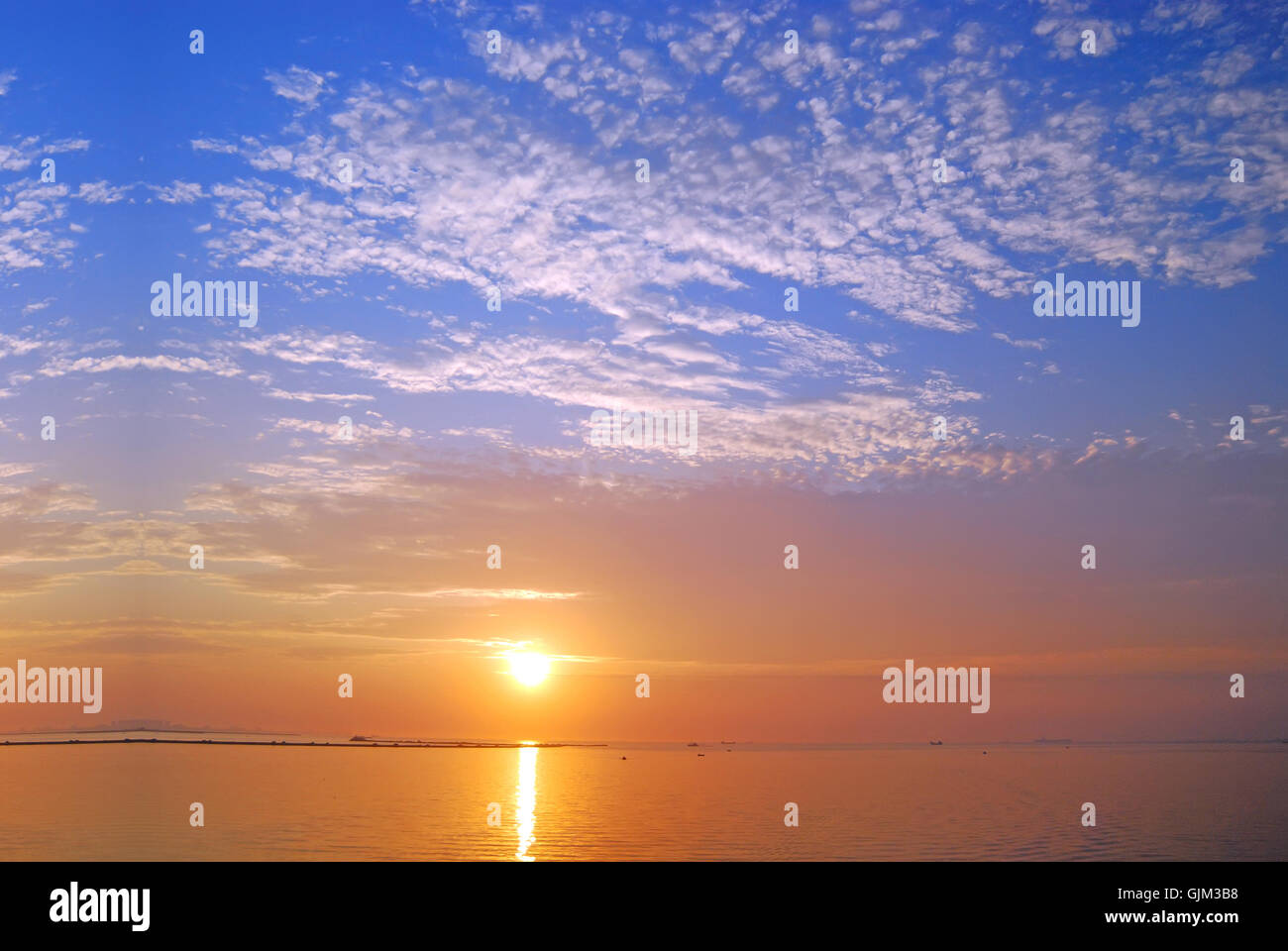 Sunset sea sky background material Stock Photo - Alamy