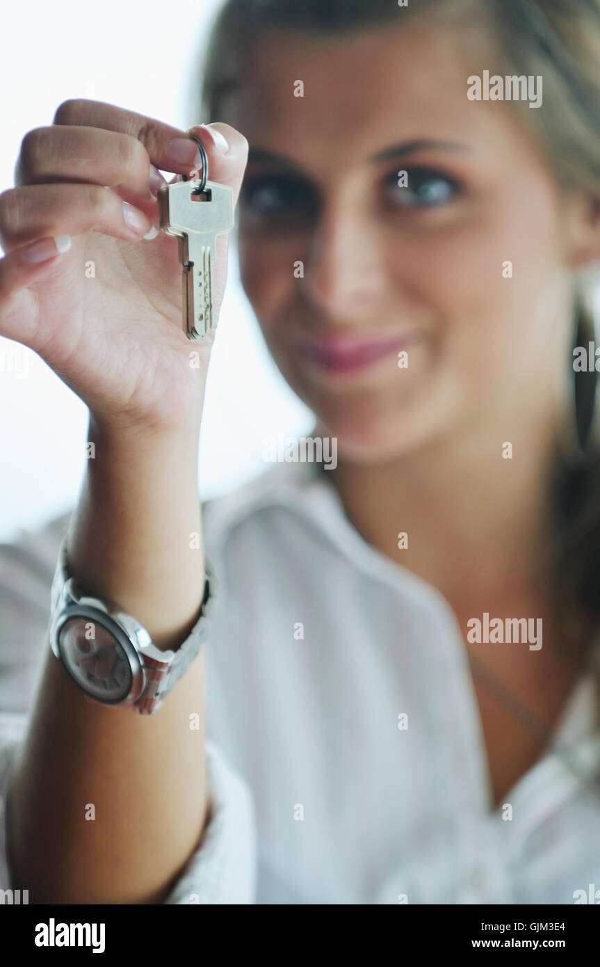 young woman throwing home keys in air Stock Photo - Alamy
