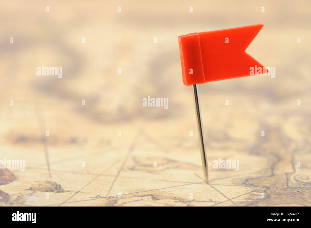 Flag red a pin on old map Stock Photo - Alamy