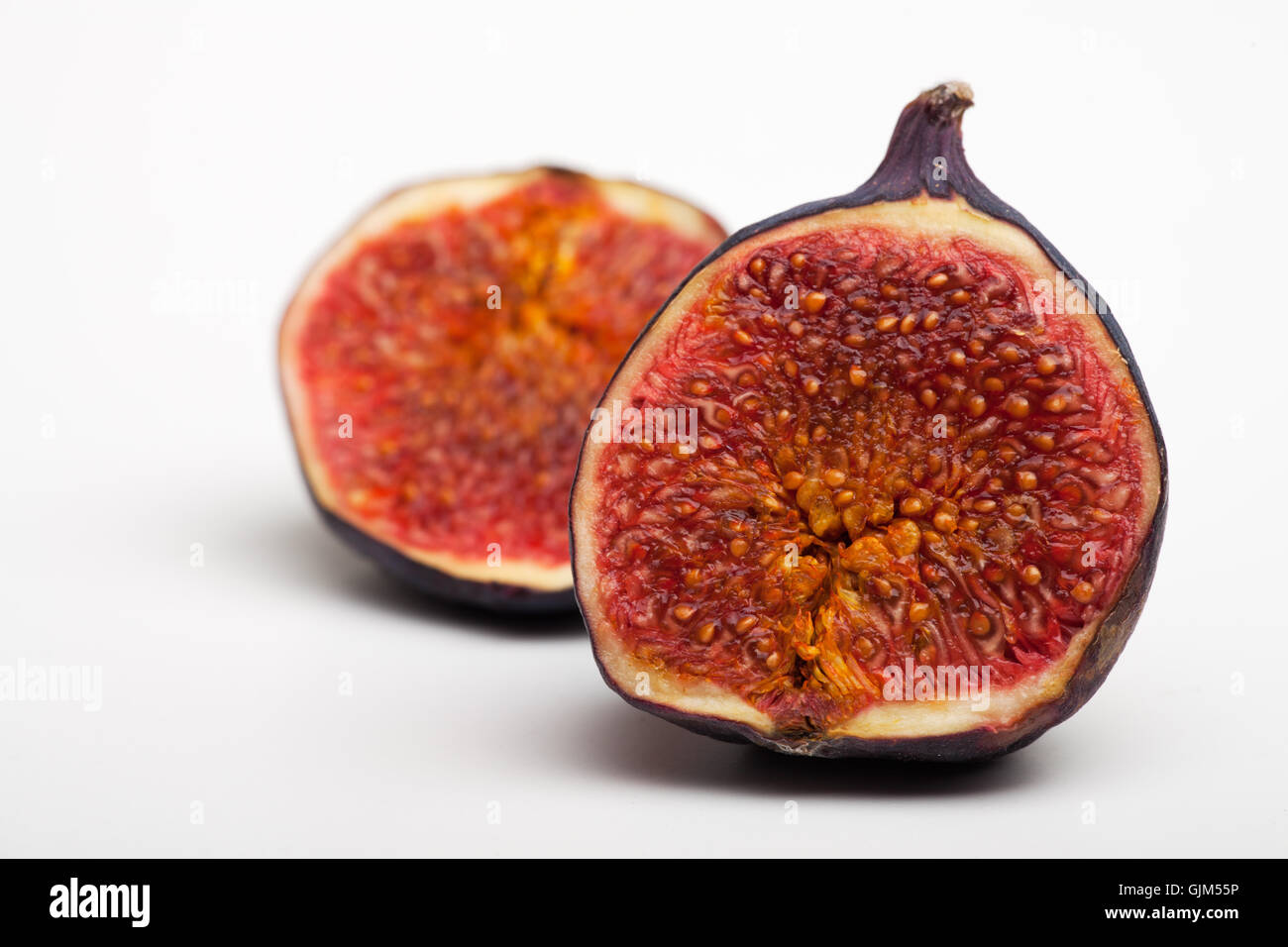 fig fruit cut in halves Stock Photo - Alamy