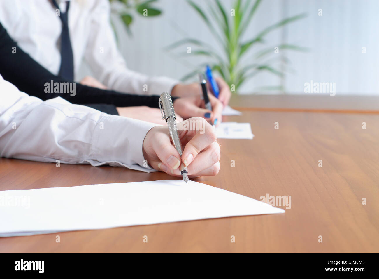 person's hand signing an important document Stock Photo - Alamy