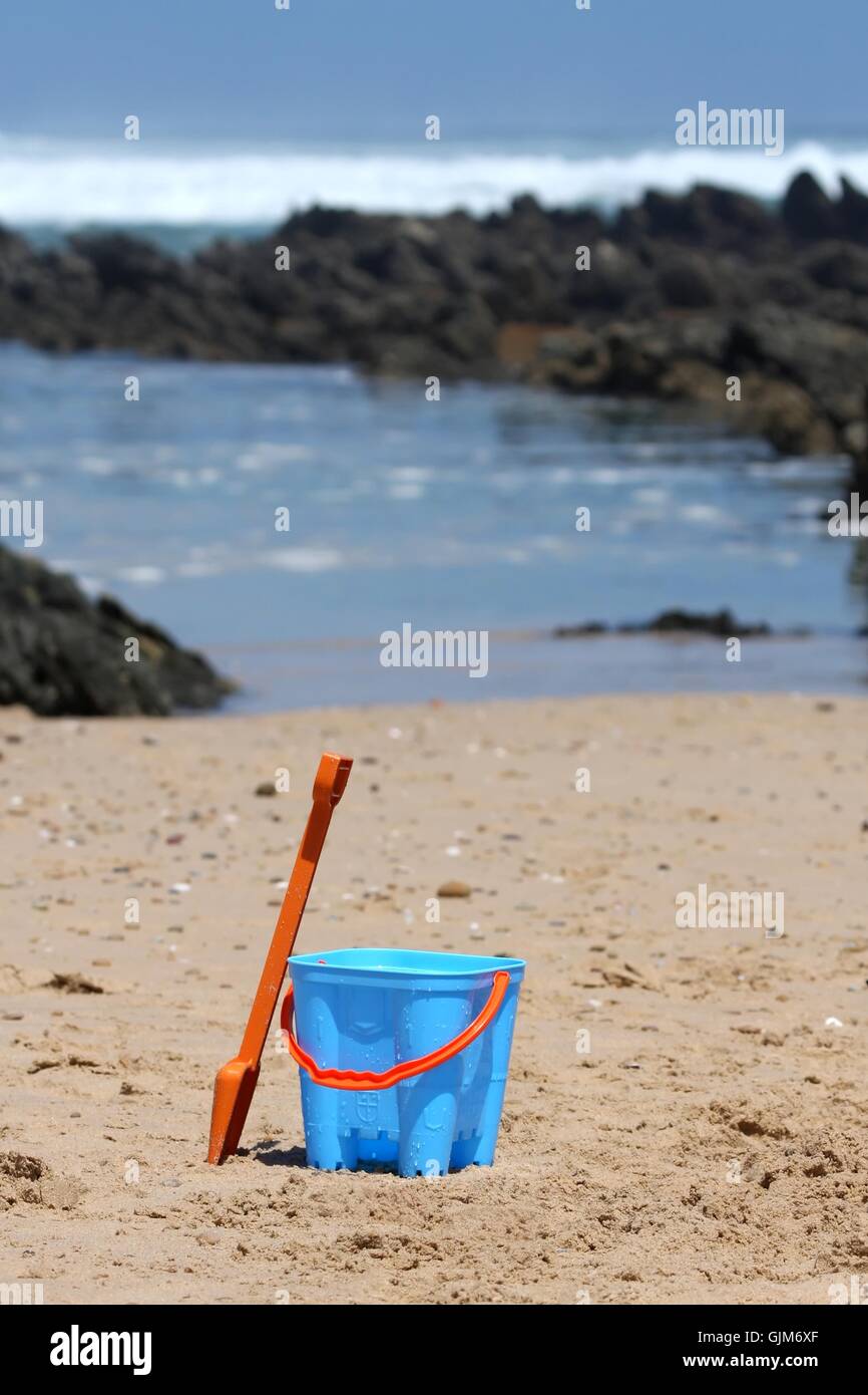 Bucket and Spade at Seashore Stock Photo - Alamy