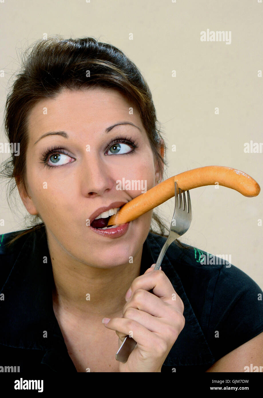 Woman eats sausage hi-res stock photography and images - Alamy