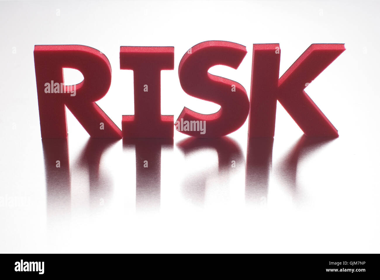 Risk word on metal background Stock Photo - Alamy