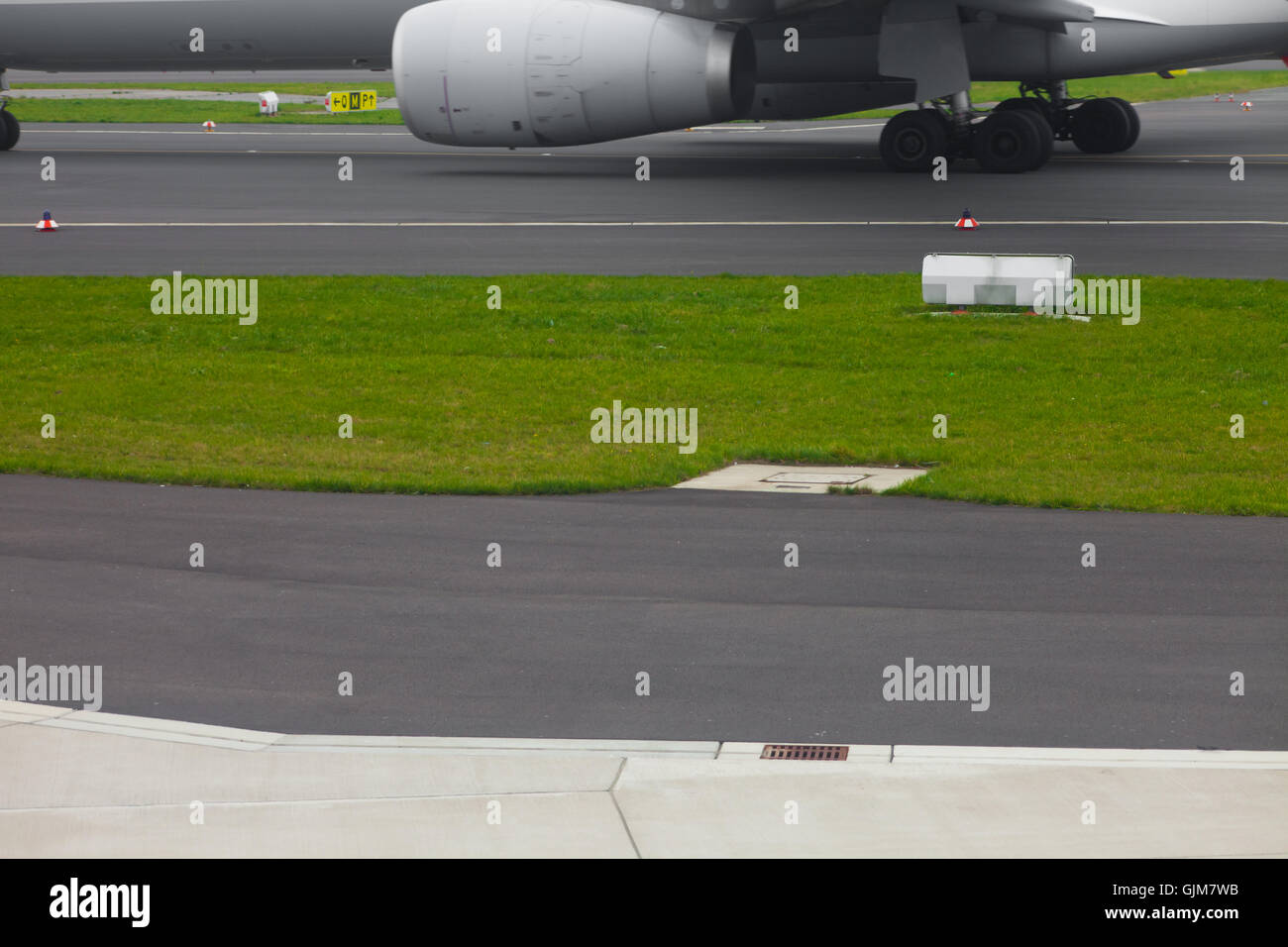 Aircraft Landing Gear and Jet Engine on Runway Stock Photo - Alamy