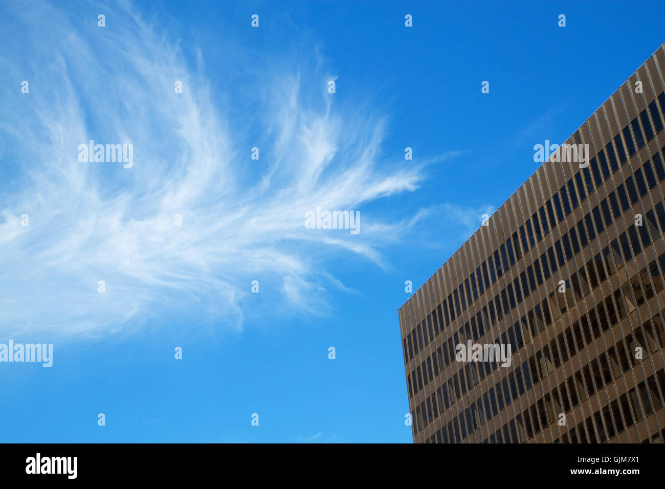 Brown Office building blue sky Stock Photo - Alamy