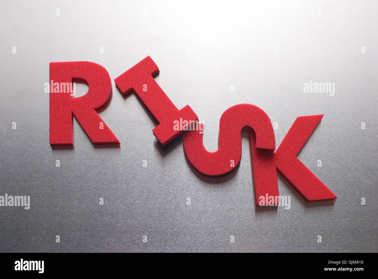 Risk word on metal background Stock Photo - Alamy