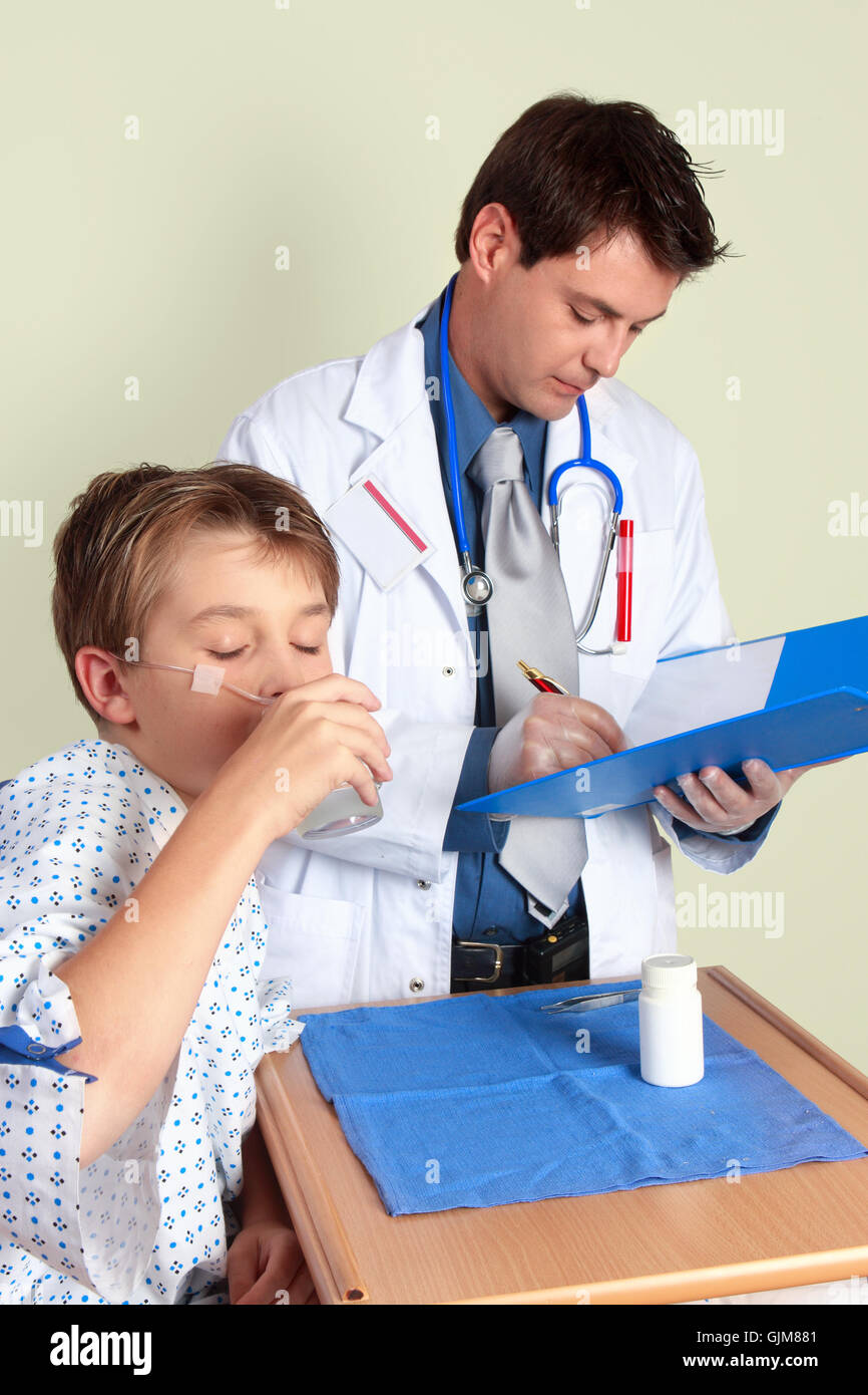 Sick child taking medicine Stock Photo - Alamy