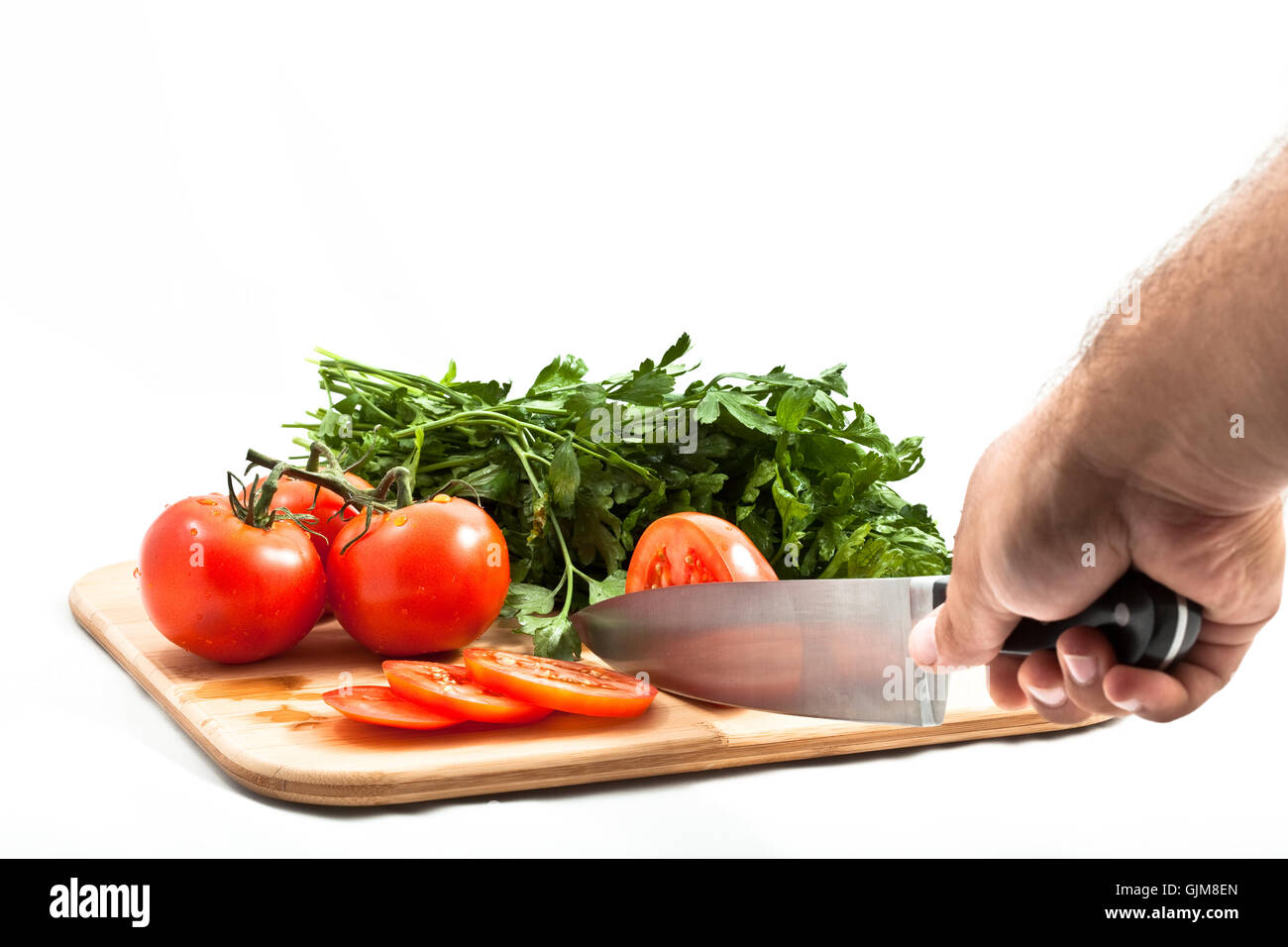 Tomato with parsely Stock Photo - Alamy