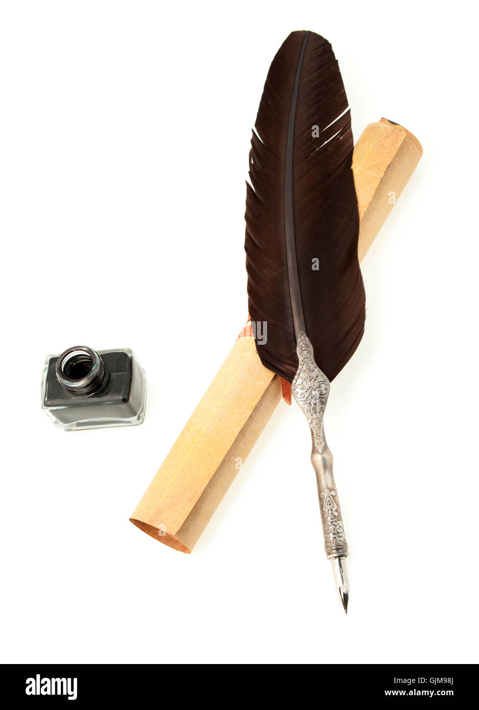 Feather quill ,inkwell and parchment roll Stock Photo - Alamy