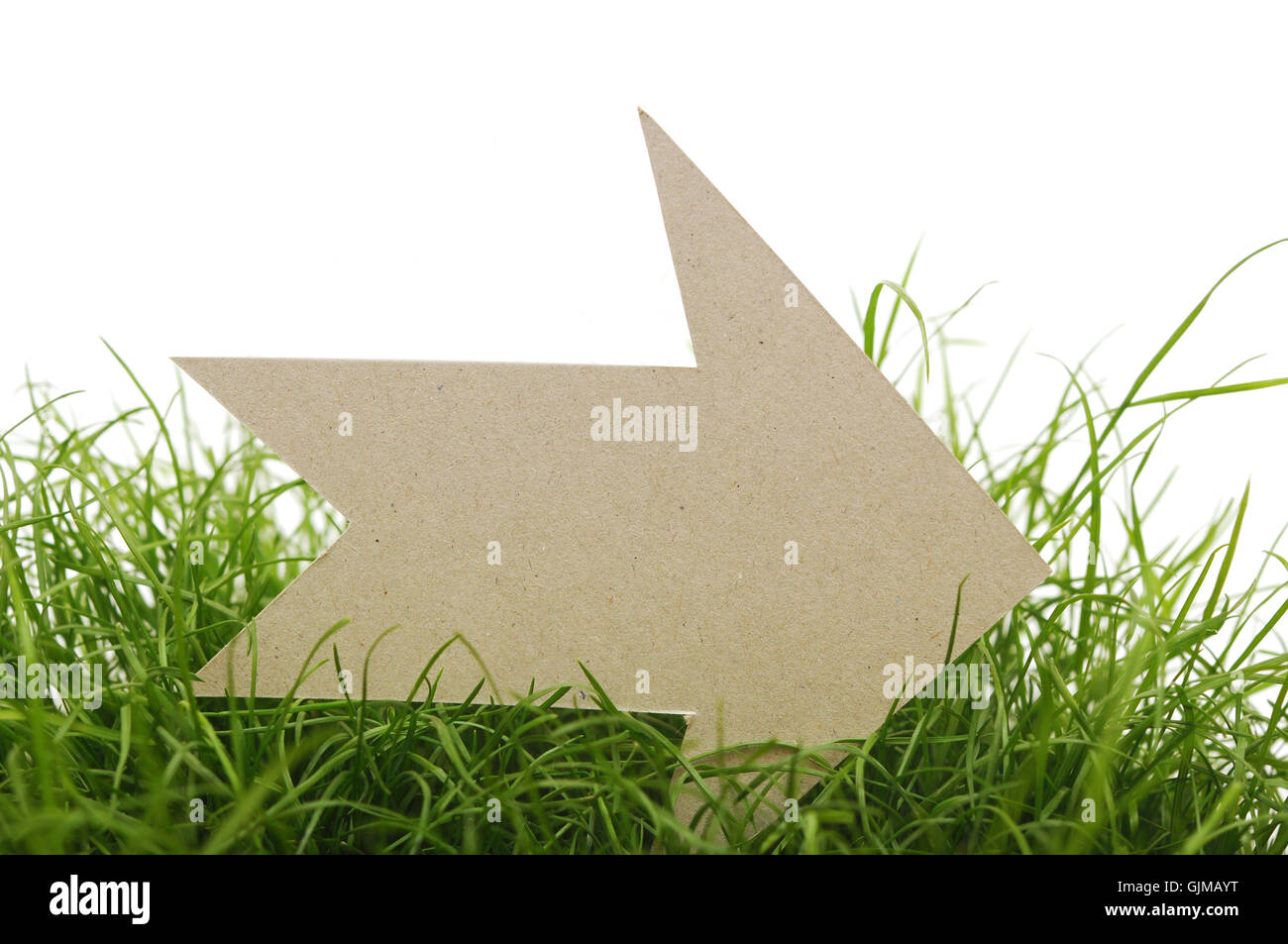 cardboard direction sign on green grass Stock Photo - Alamy