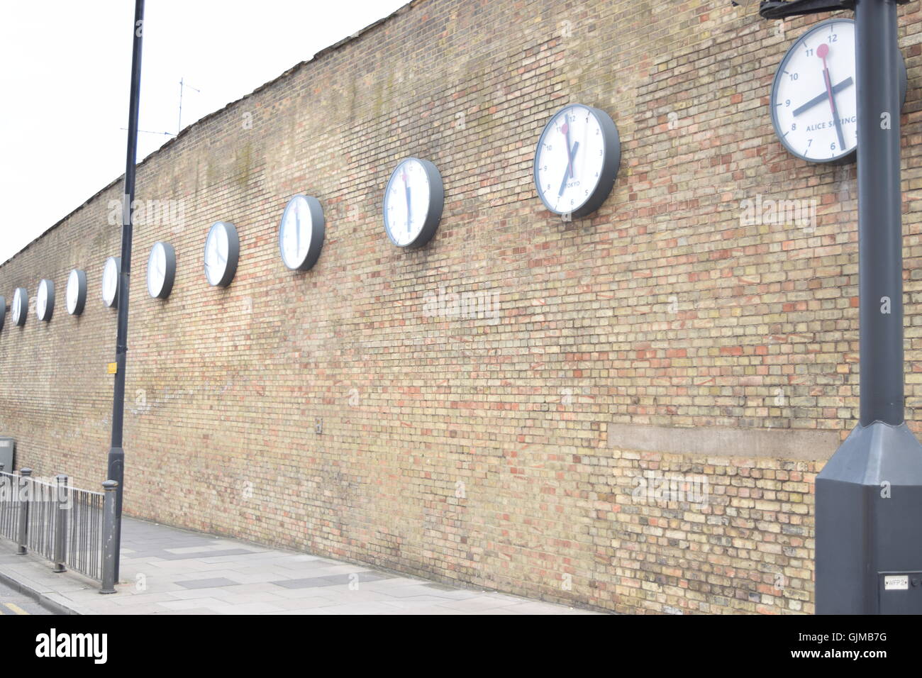 Outside of a Building with many Clocks Stock Photo - Alamy