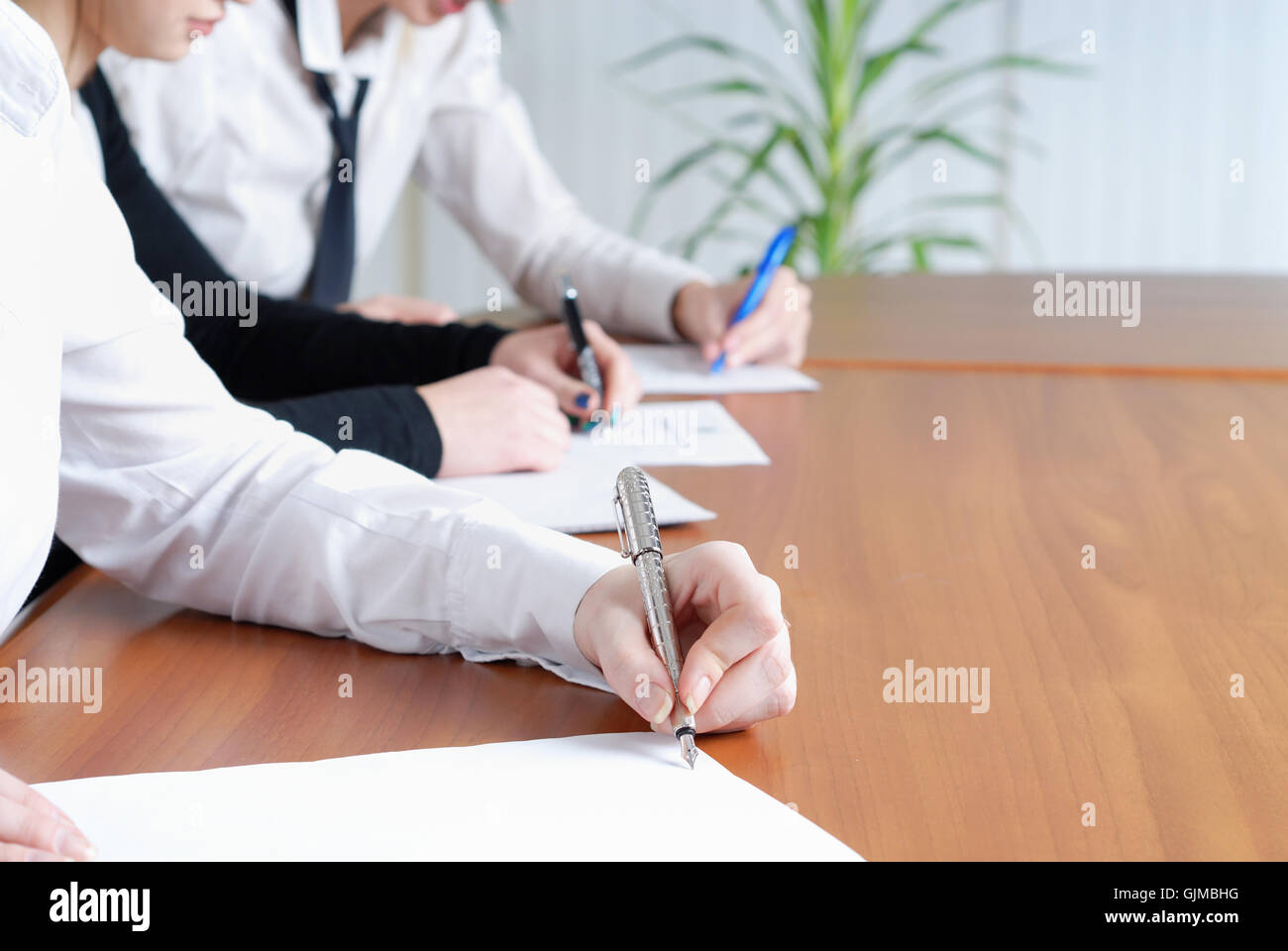 person's hand signing an important document Stock Photo - Alamy