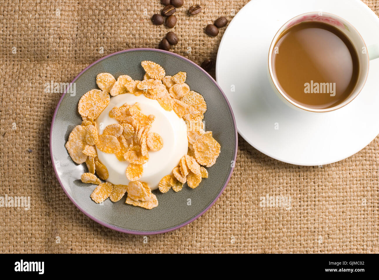 Milk pudding with sweet crisps and coffee Stock Photo - Alamy