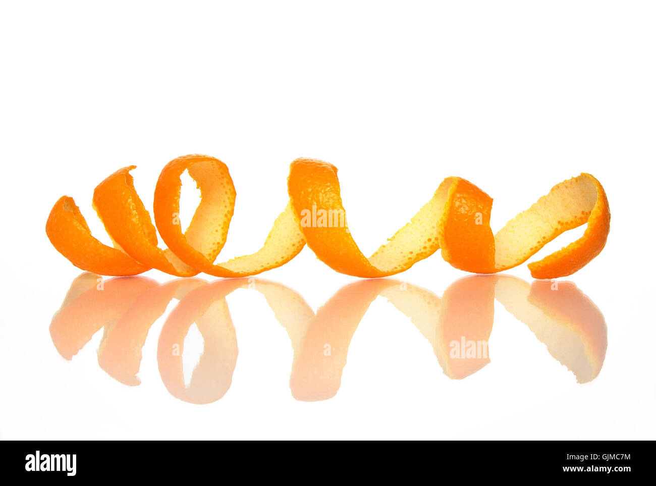 Spiral orange peel with reflection Stock Photo - Alamy