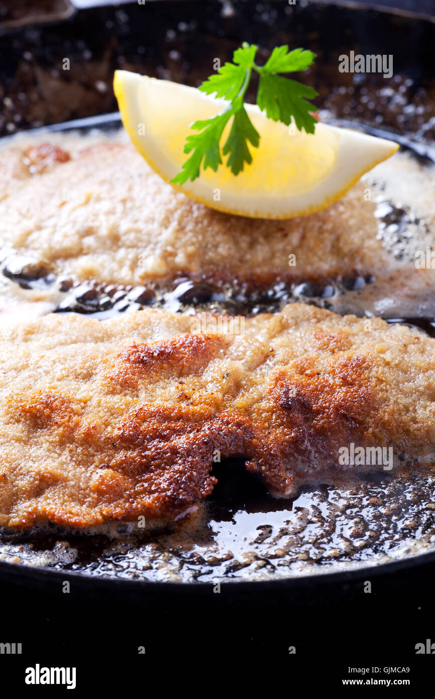 wiener schnitzel frying in a pan Stock Photo - Alamy