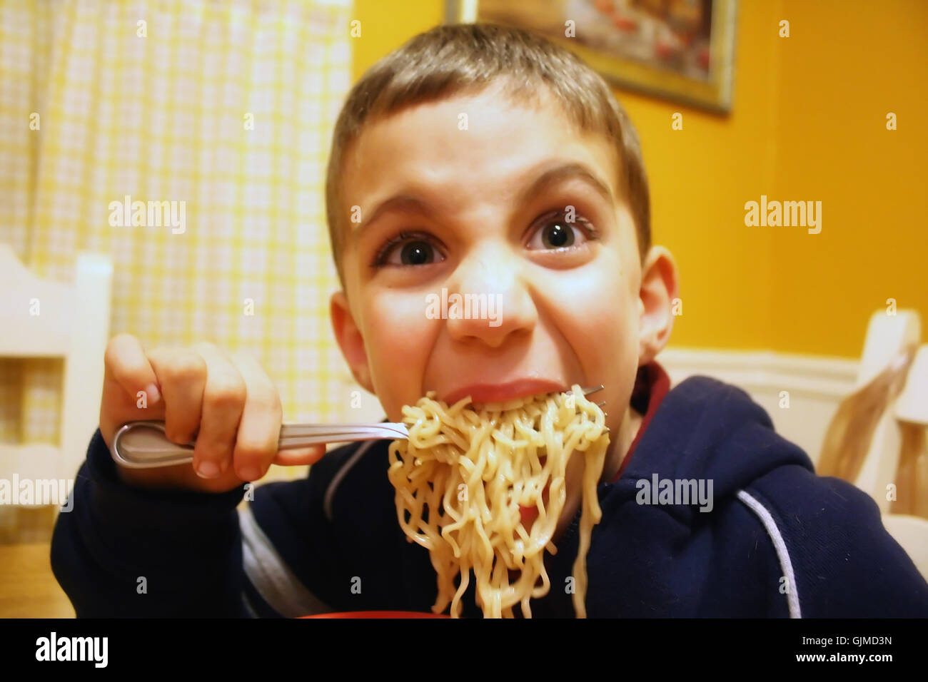 boy eating pasta Stock Photo - Alamy