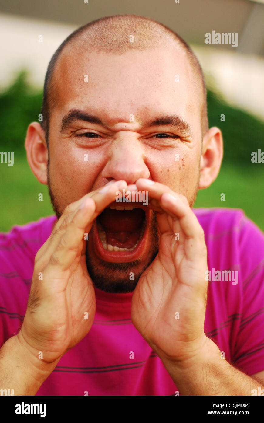 Closeup of a young man screaming Stock Photo - Alamy