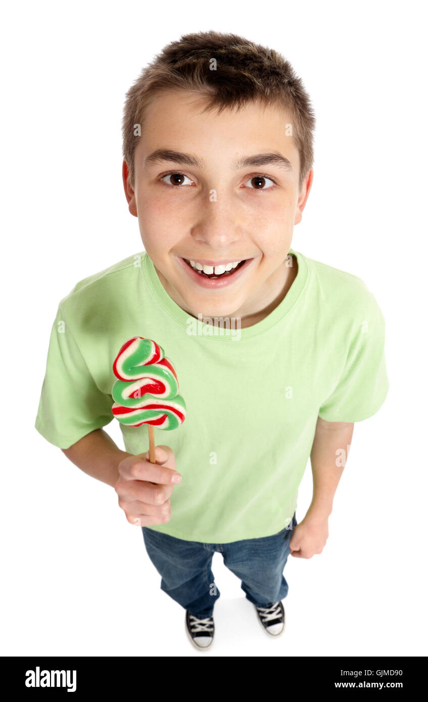 Happy boy holding a lollipop candy Stock Photo - Alamy