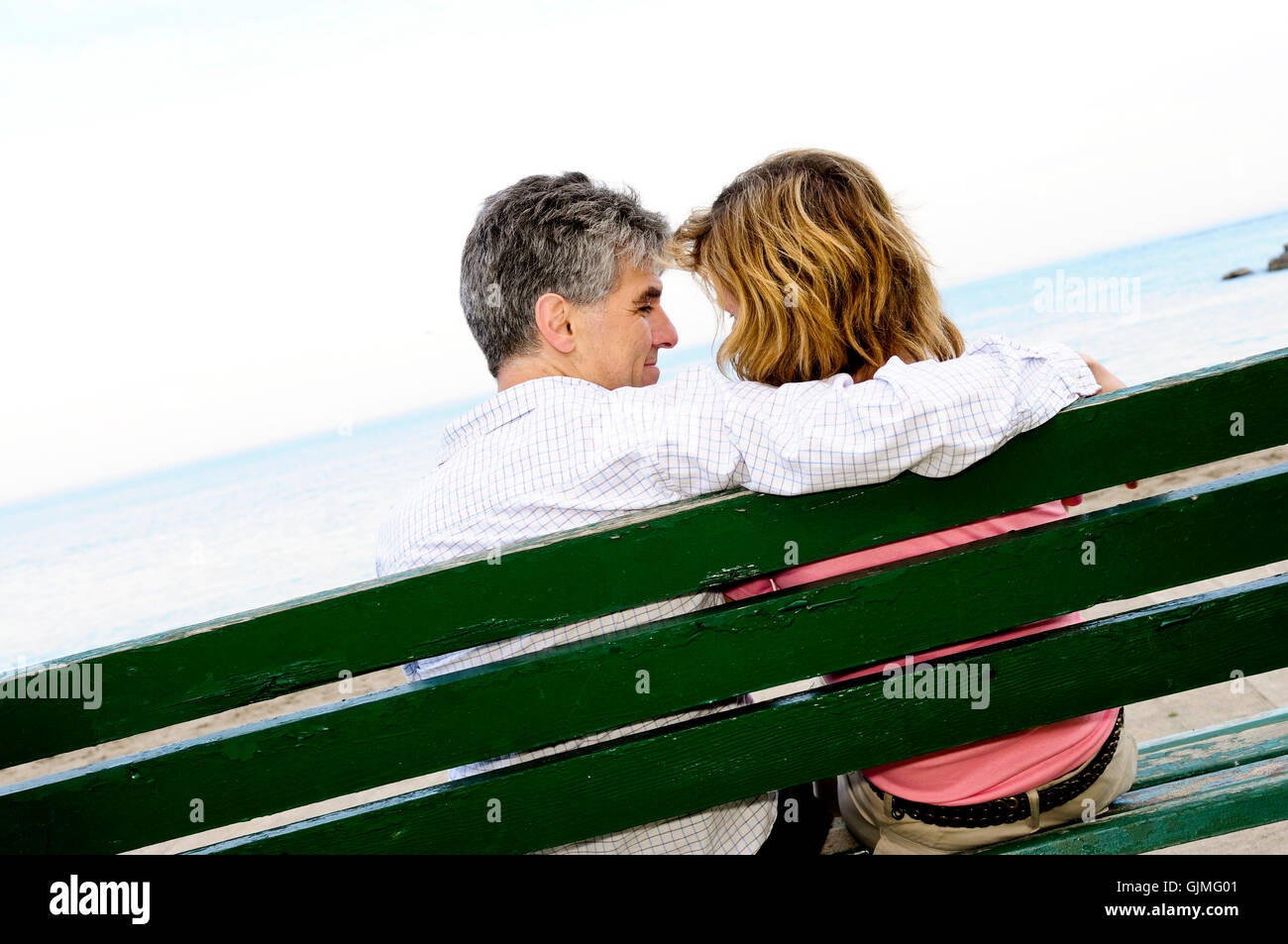 Couple hugging in back seat hi-res stock photography and images - Alamy