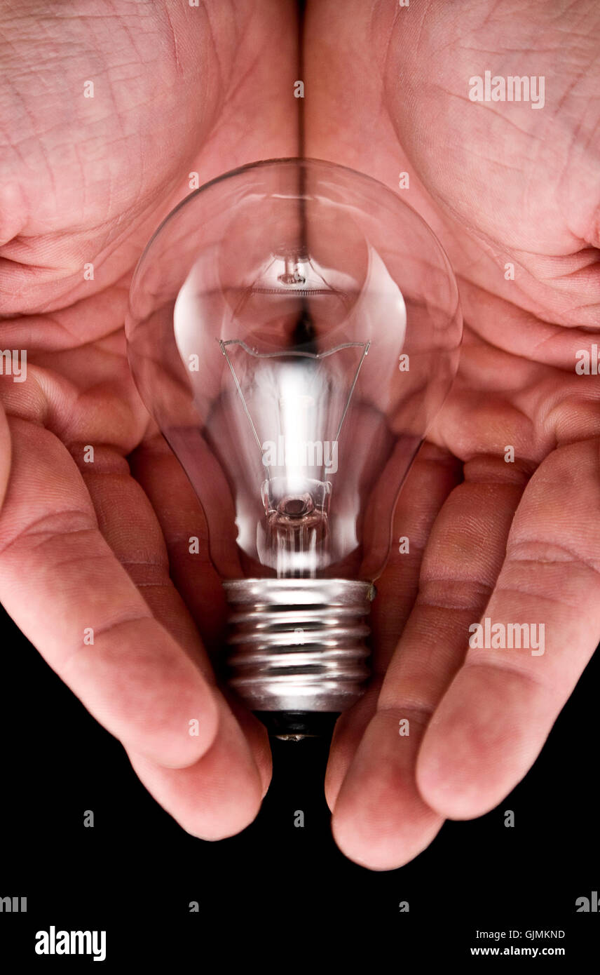 hand with light bulb Stock Photo - Alamy