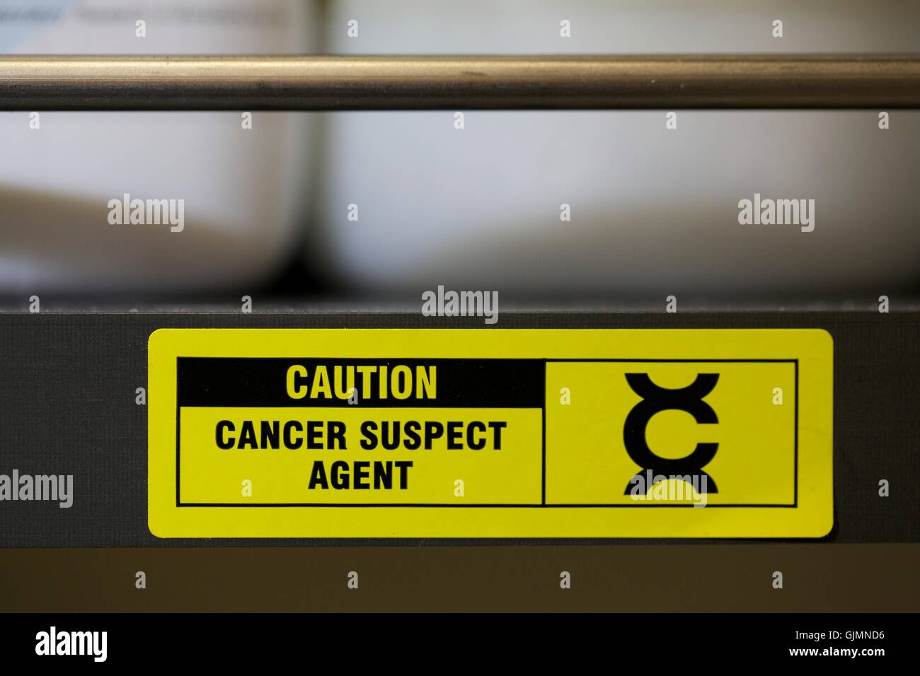 Cancer suspect warning on chemical shelf in laboratory Stock Photo - Alamy