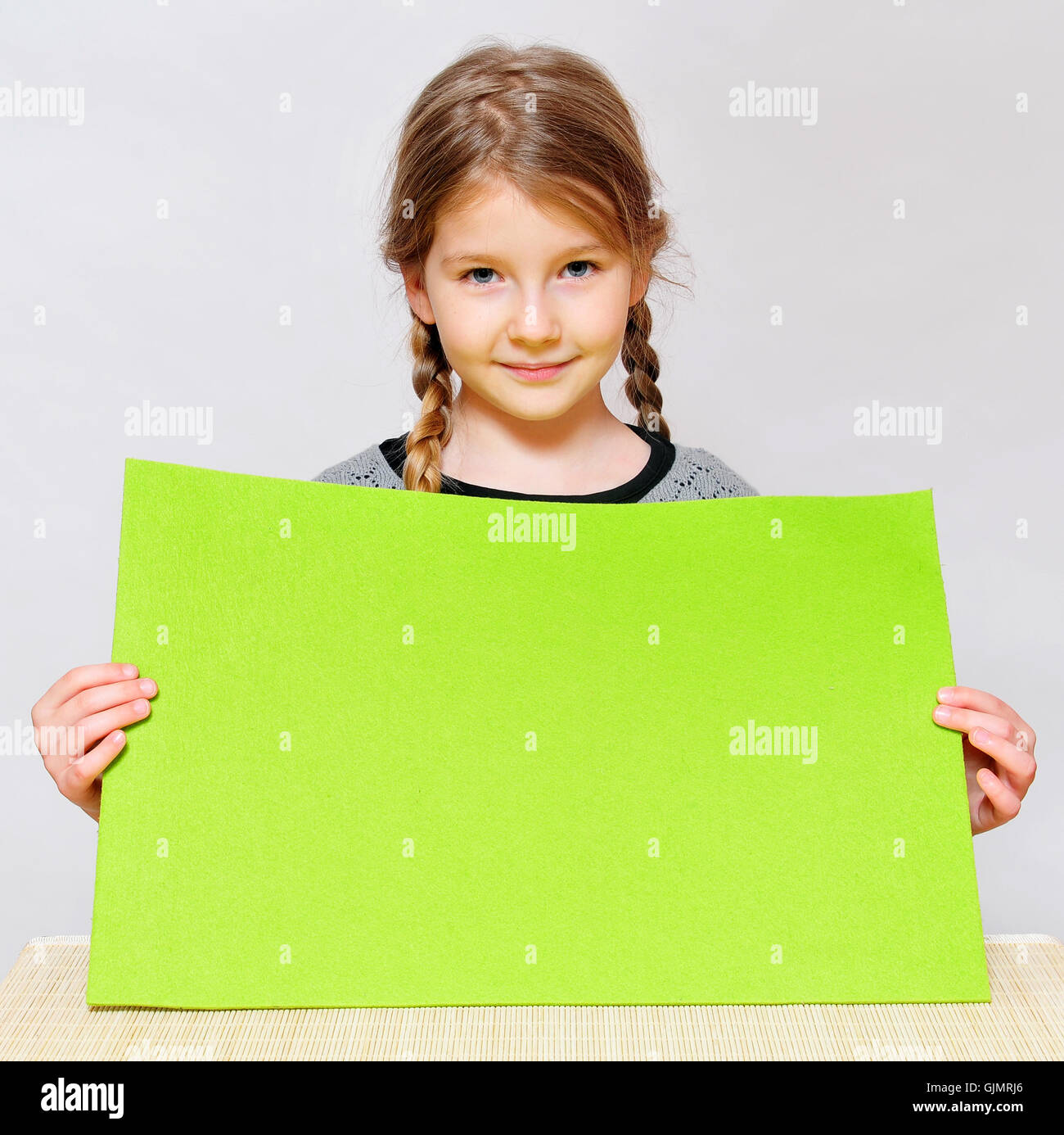 girl holding sign Stock Photo - Alamy