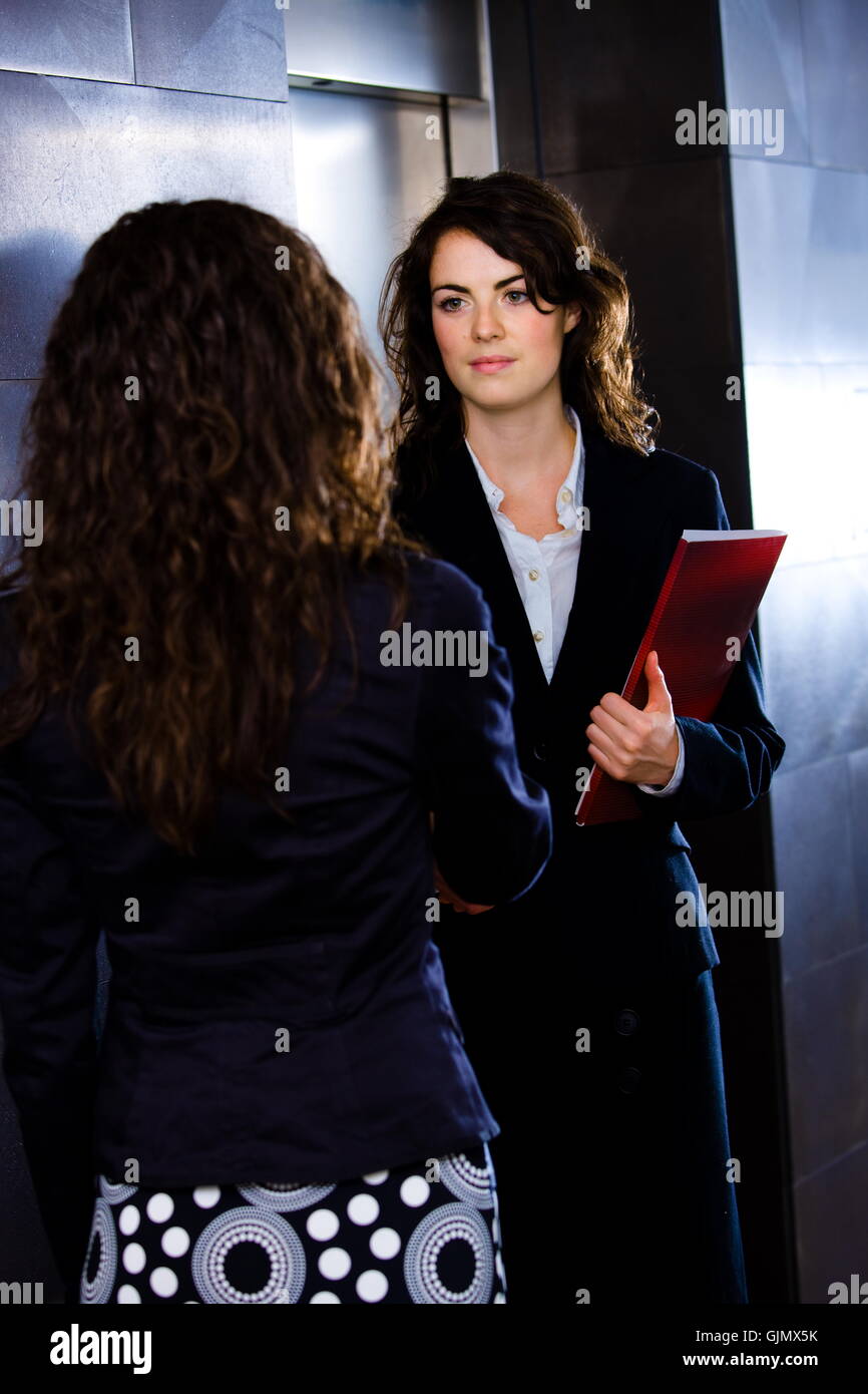 Attractive young woman waiting lift hi-res stock photography and images ...