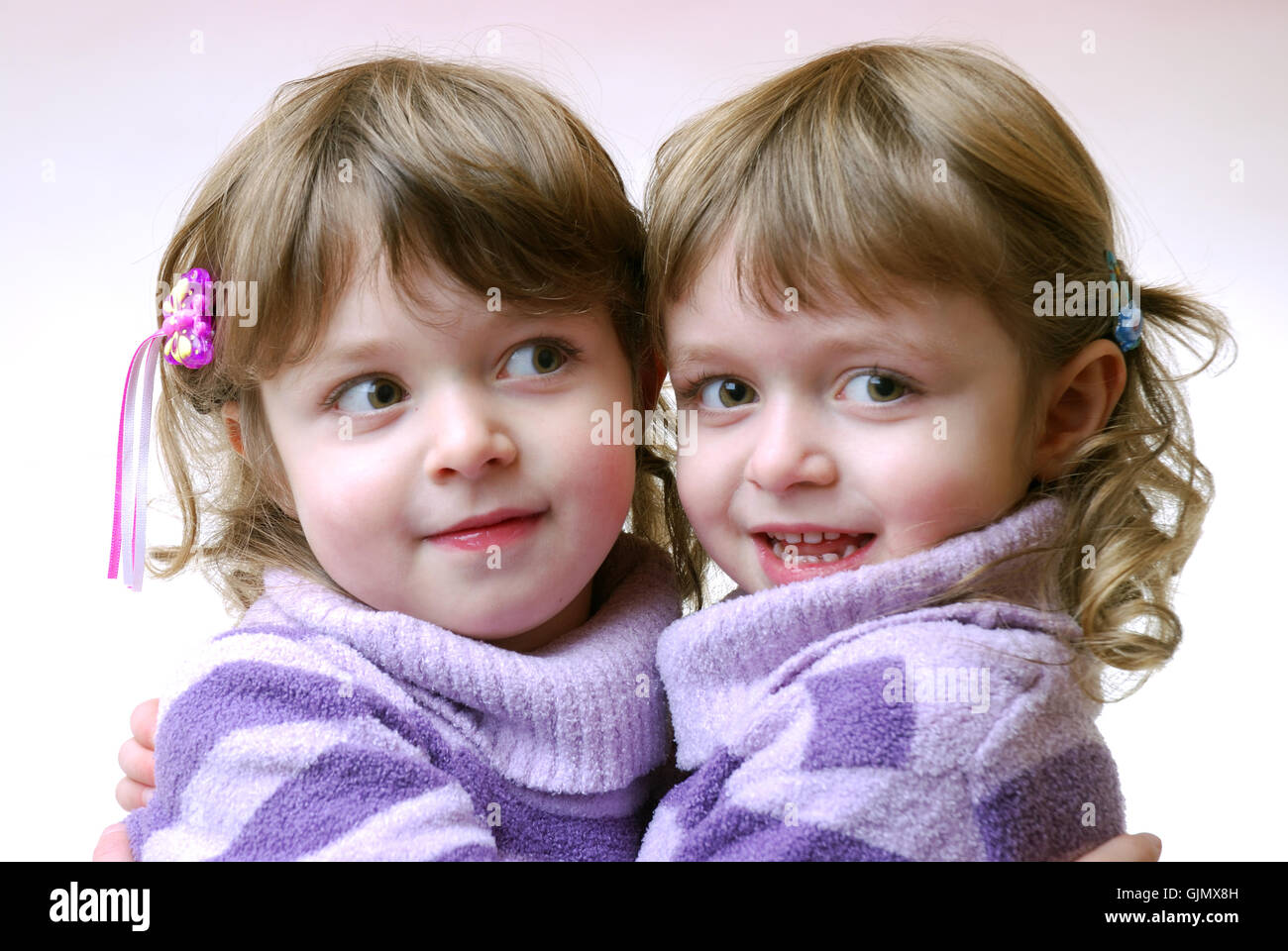 Twins embrace hi-res stock photography and images - Alamy