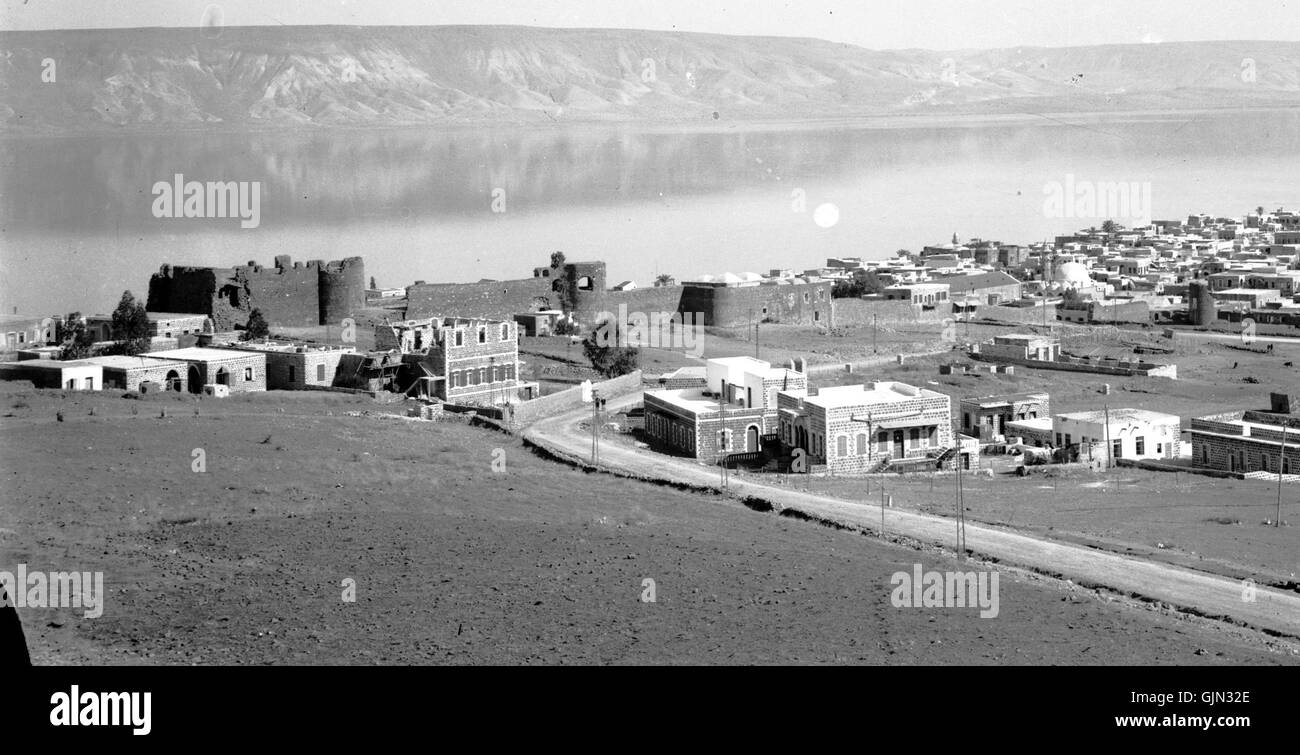 This photograph offers a distant view of Tiberias, an ancient city ...
