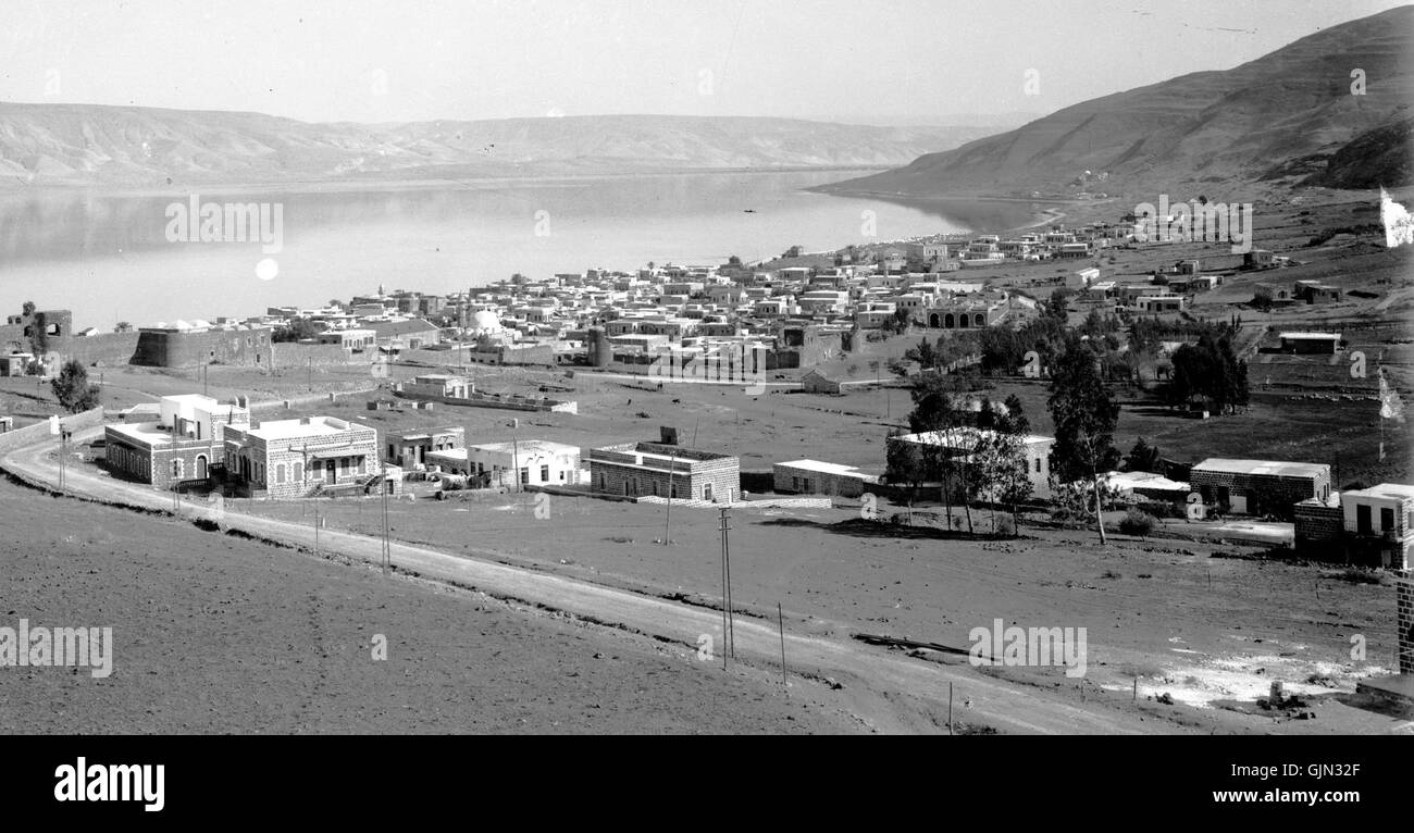 This photograph captures a distant view of Tiberias, an ancient city ...
