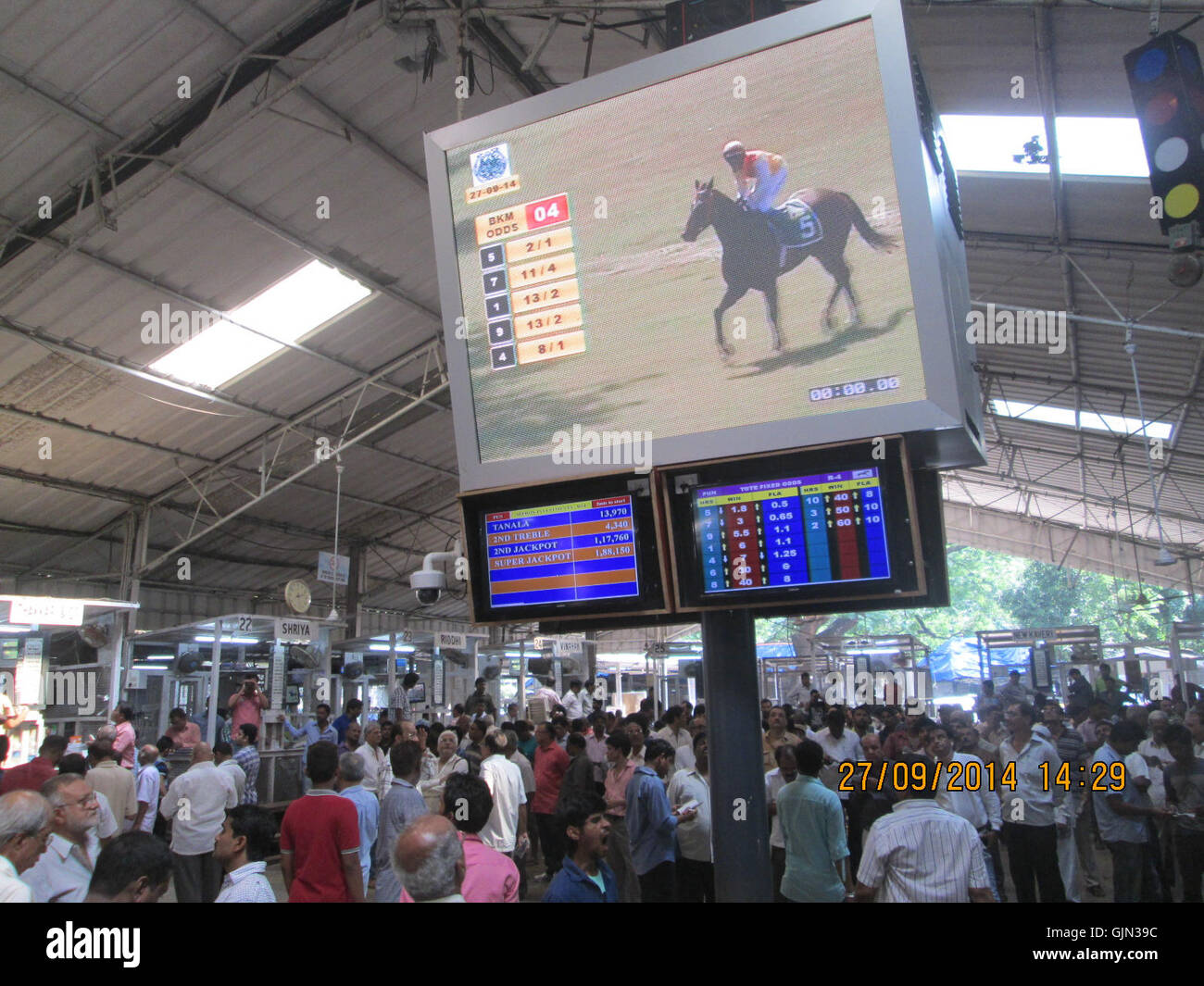 An image depicting the betting ring at a racecourse, where large sums ...
