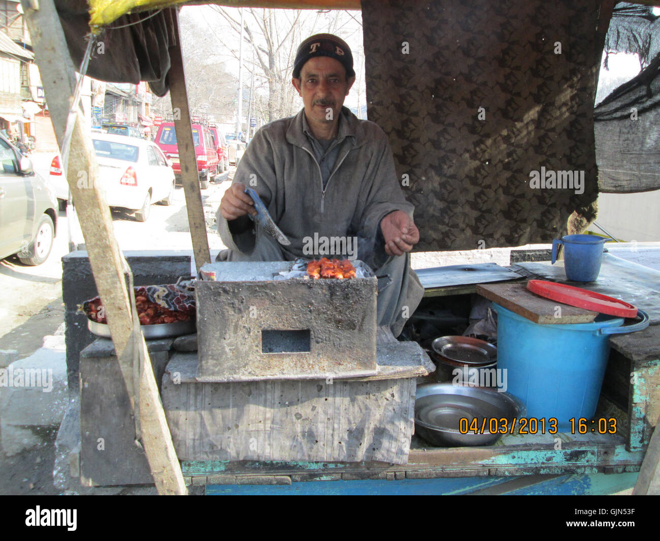 A street hawker selling Seekh Kabaab in Srinagar, Kashmir. The image ...