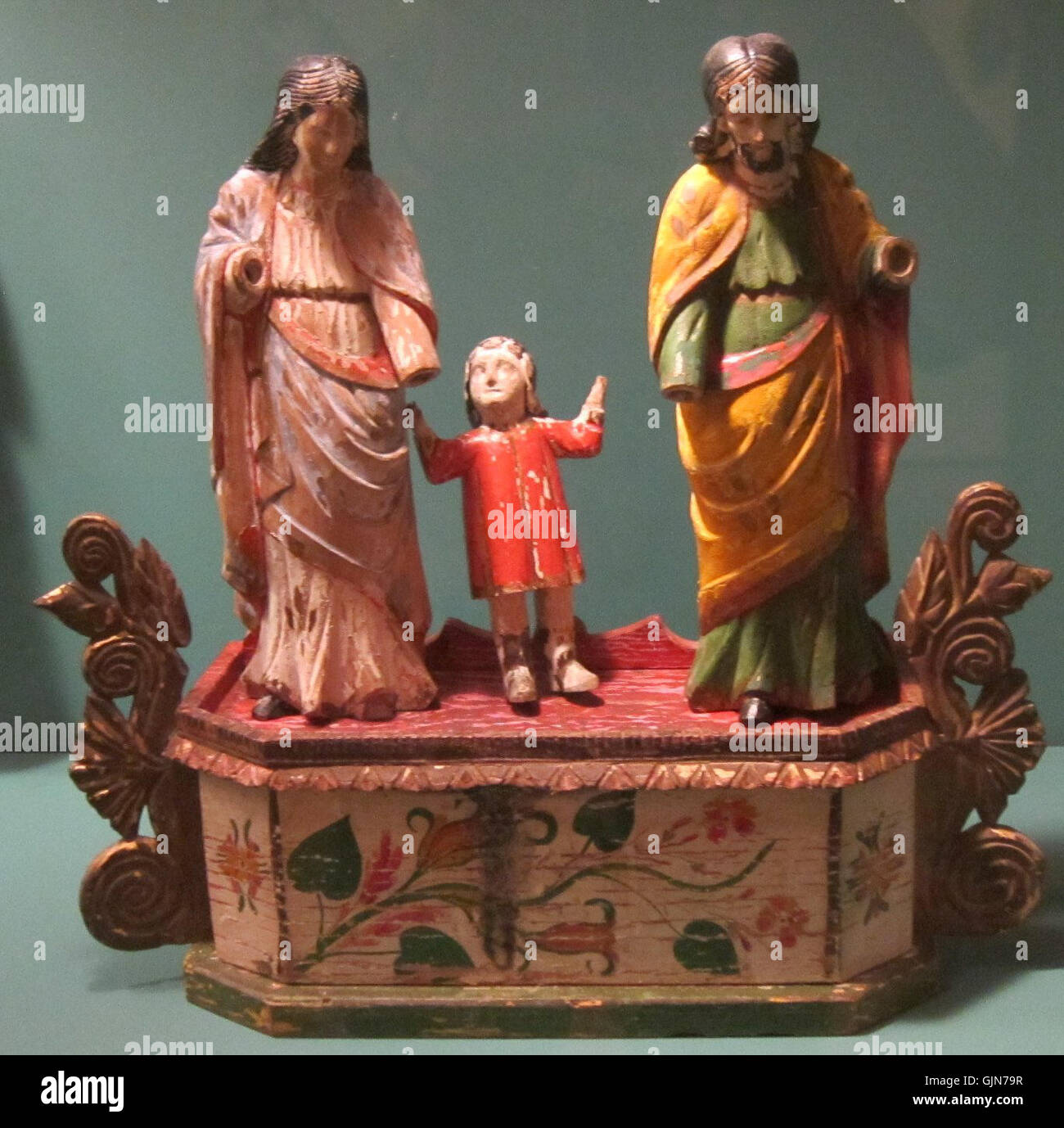 This Philippine artwork, titled 'The Holy Family,' is a wooden ...