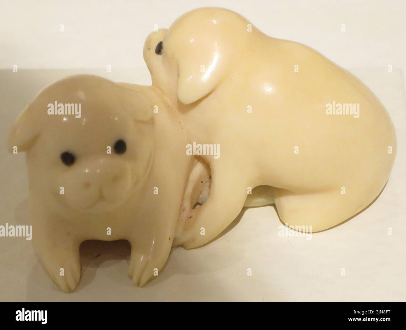 *Two Puppies* is a 20th-century Japanese netsuke carving made from ...
